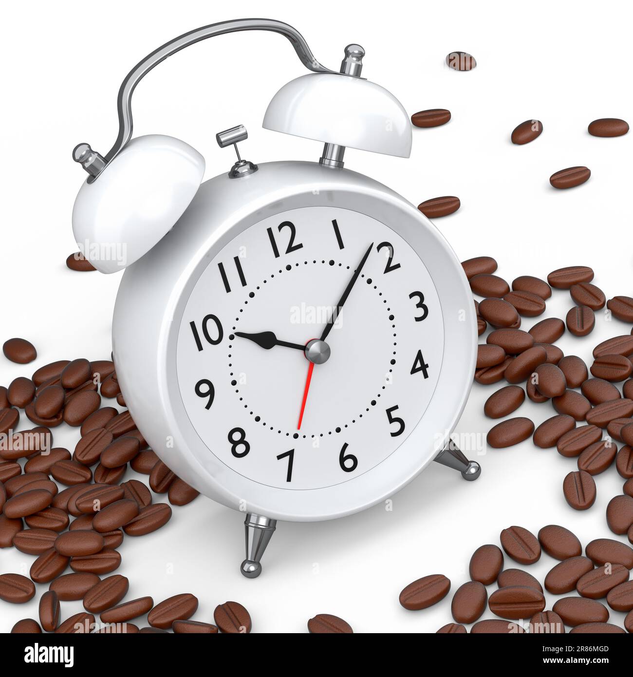 Vintage alarm clock with roasted coffee beans spread out on white ...