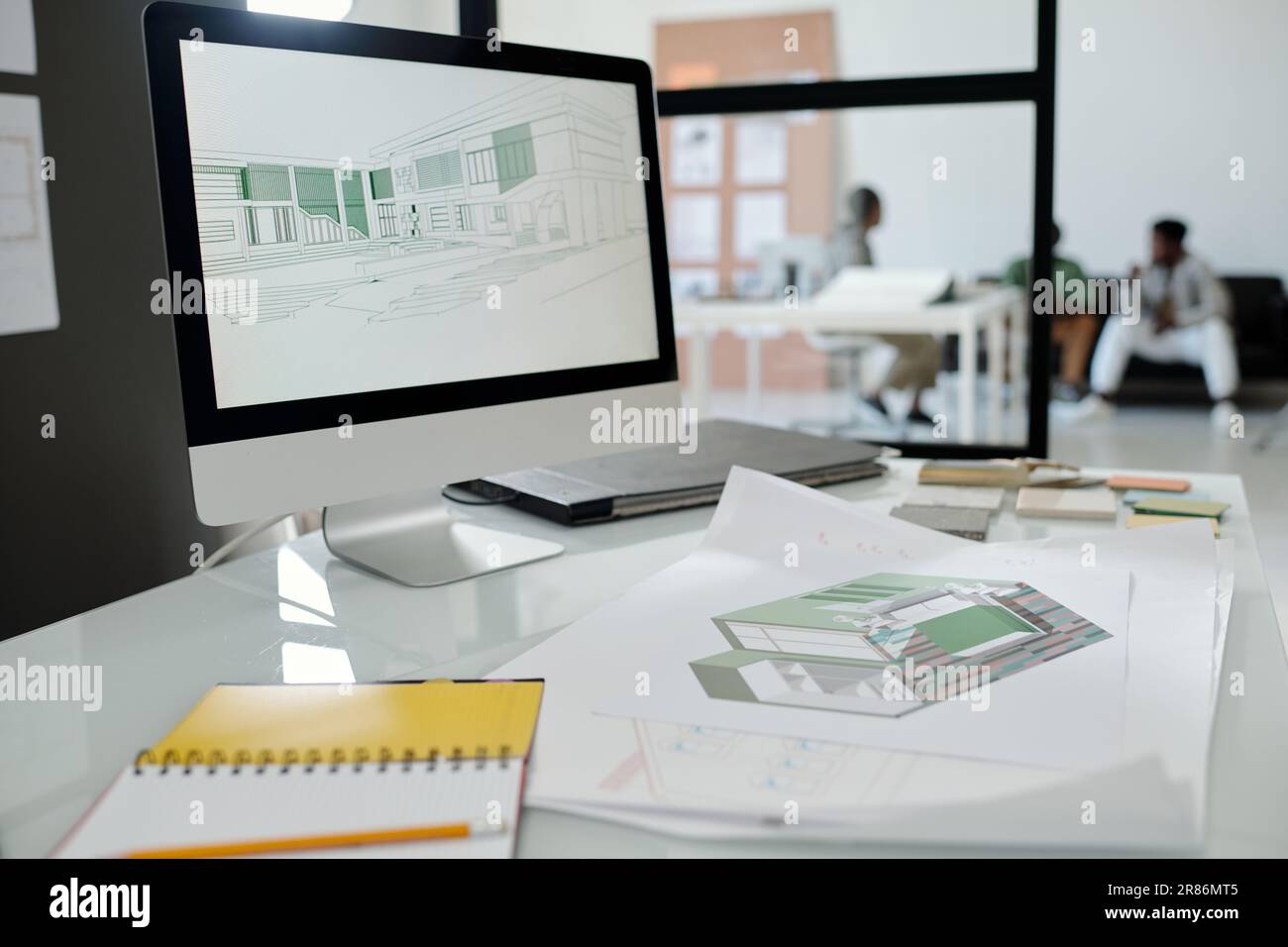 Computer monitor with architectural sketches on screen standing on ...