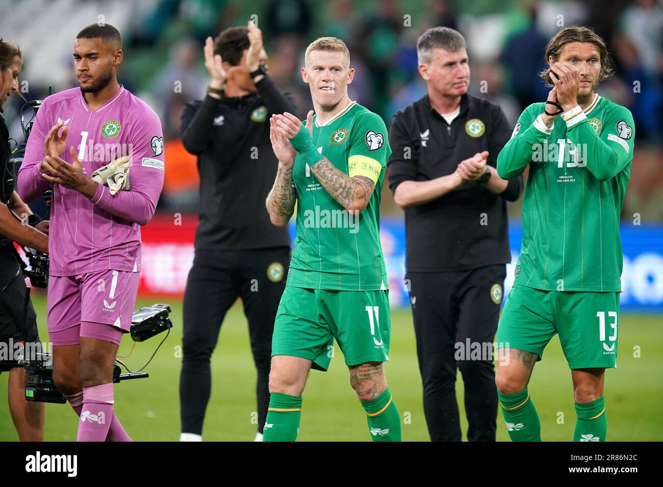 Republic of Ireland goalkeeper Gavin Bazunu (left), James McClean, head ...