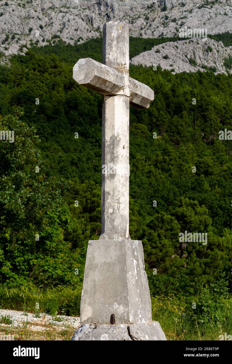 Old stone cross in front of the mountain Stock Photo - Alamy