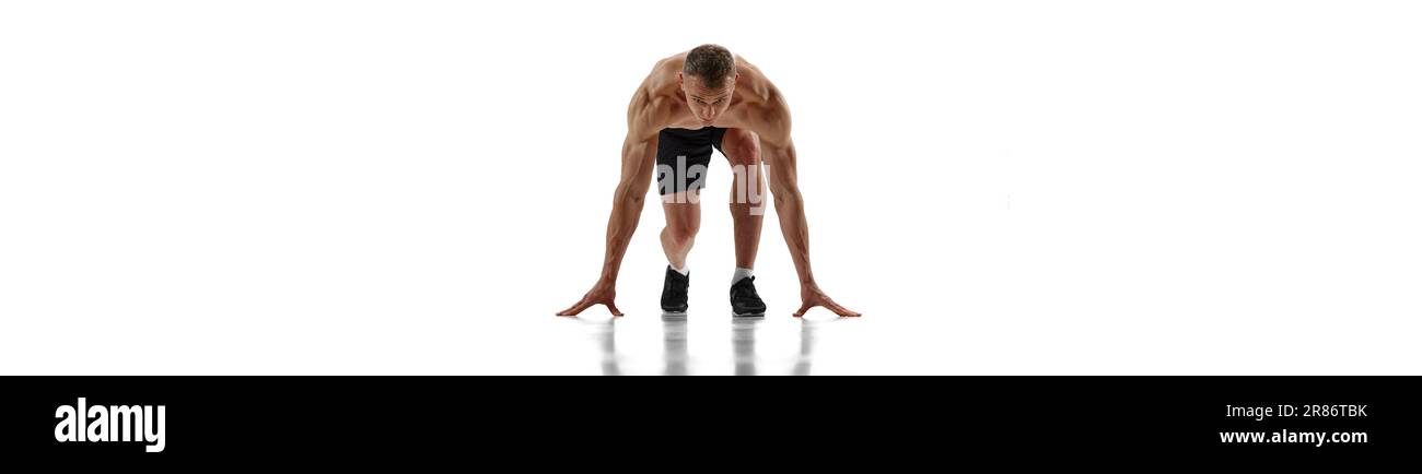 Ready, steady, go. Muscular man, professional runner standing in ...