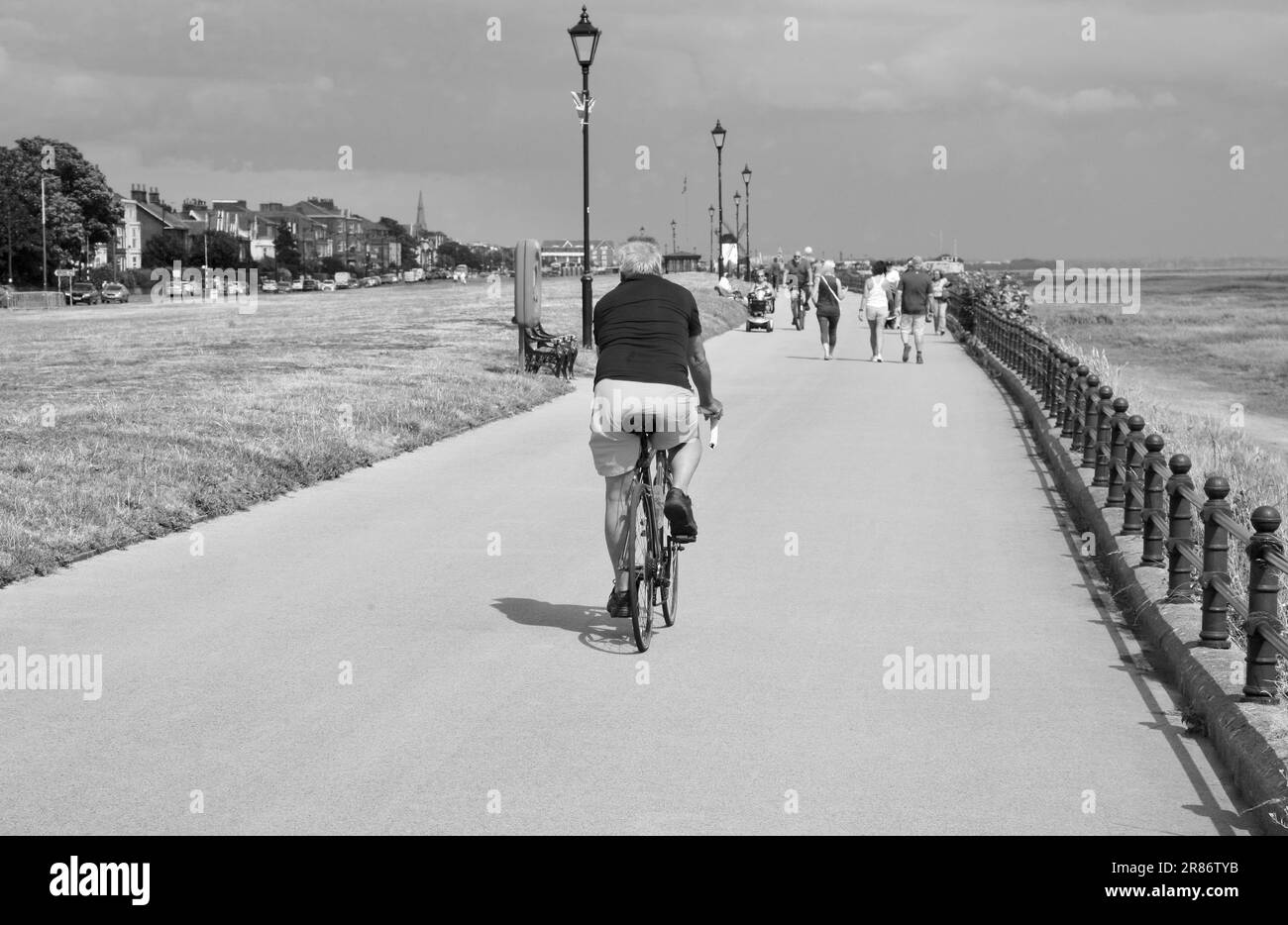 A cyclist speeding along the promenade, Lytham St Annes, Lancashire ...