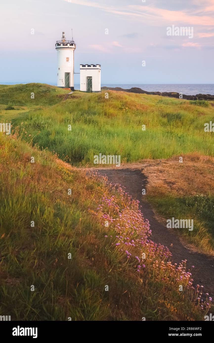 Scenic seascape landscape at dusk of Elie Ness Lighthouse on the East ...
