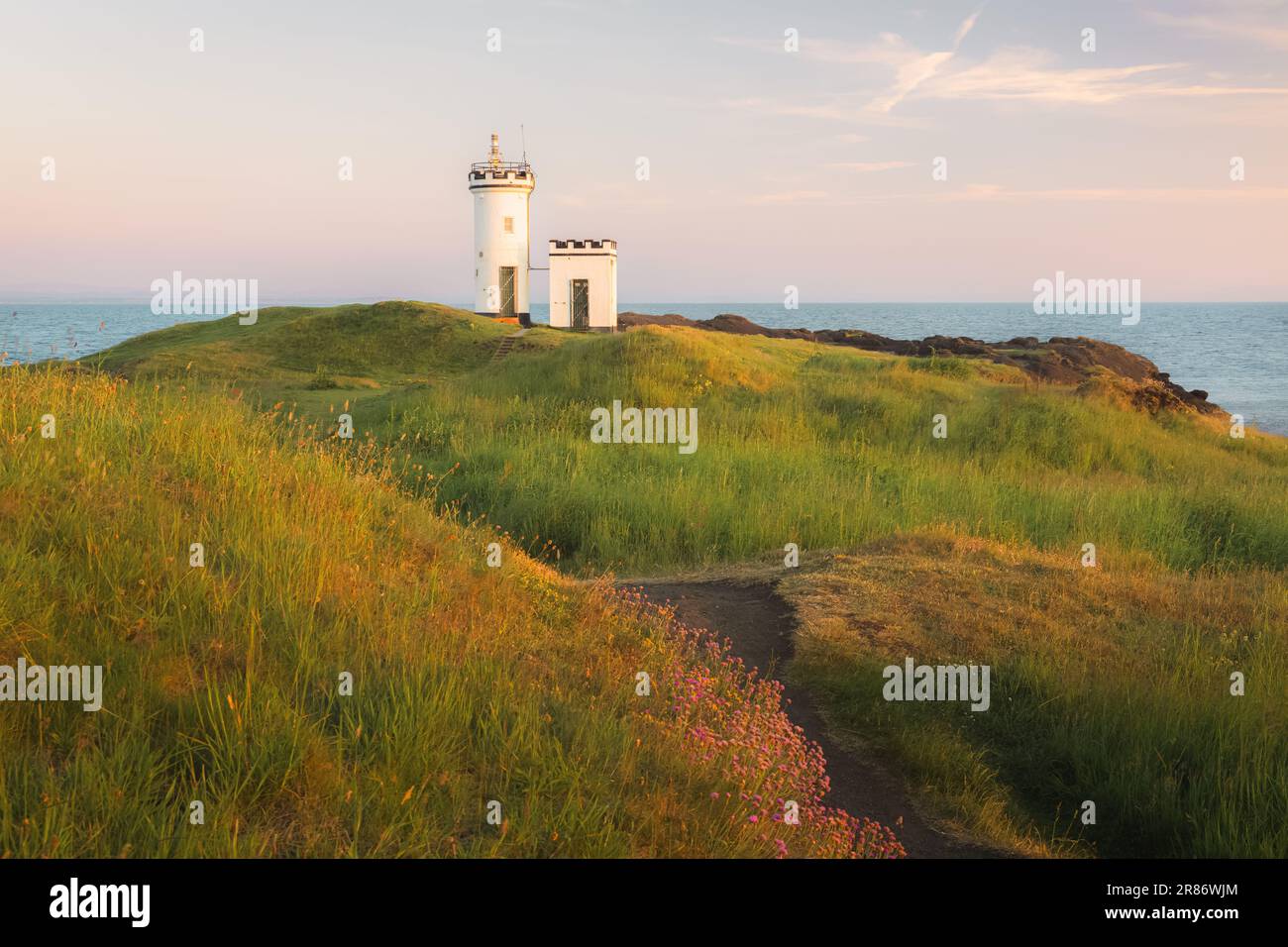 Scenic seascape landscape at sunset or sunrise of Elie Ness Lighthouse ...