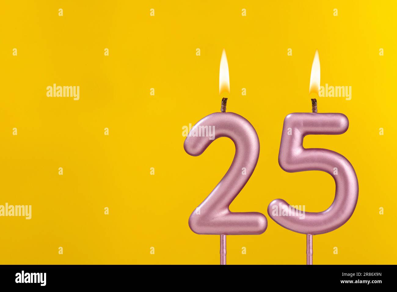 Birthday candle number 25 - Birthday celebration on yellow background ...