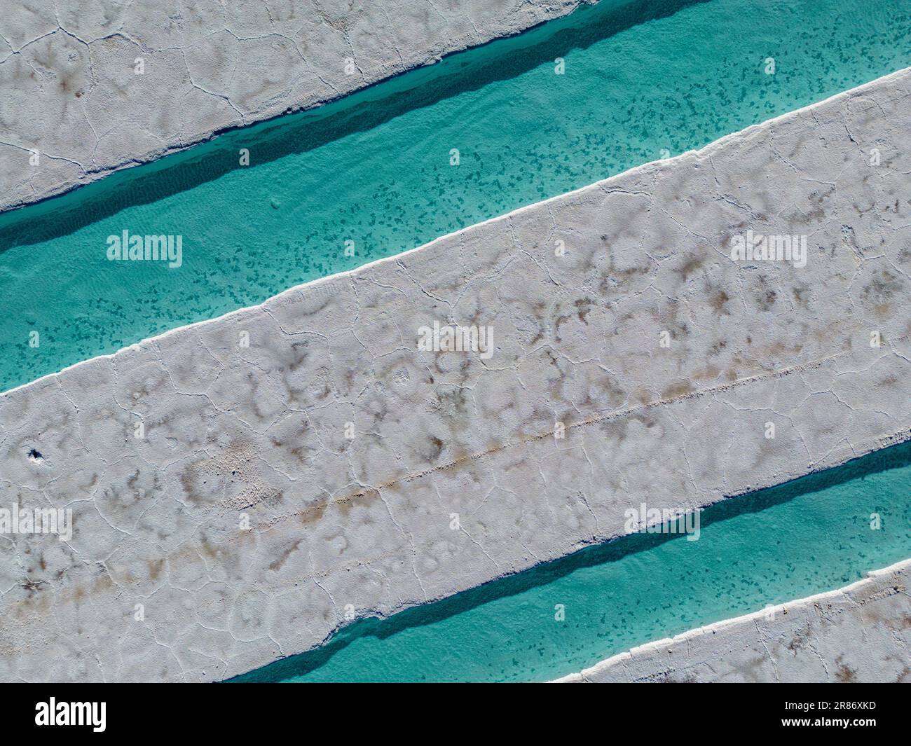 Aerial view of the salt basins in the salt crust of the huge salt flats ...