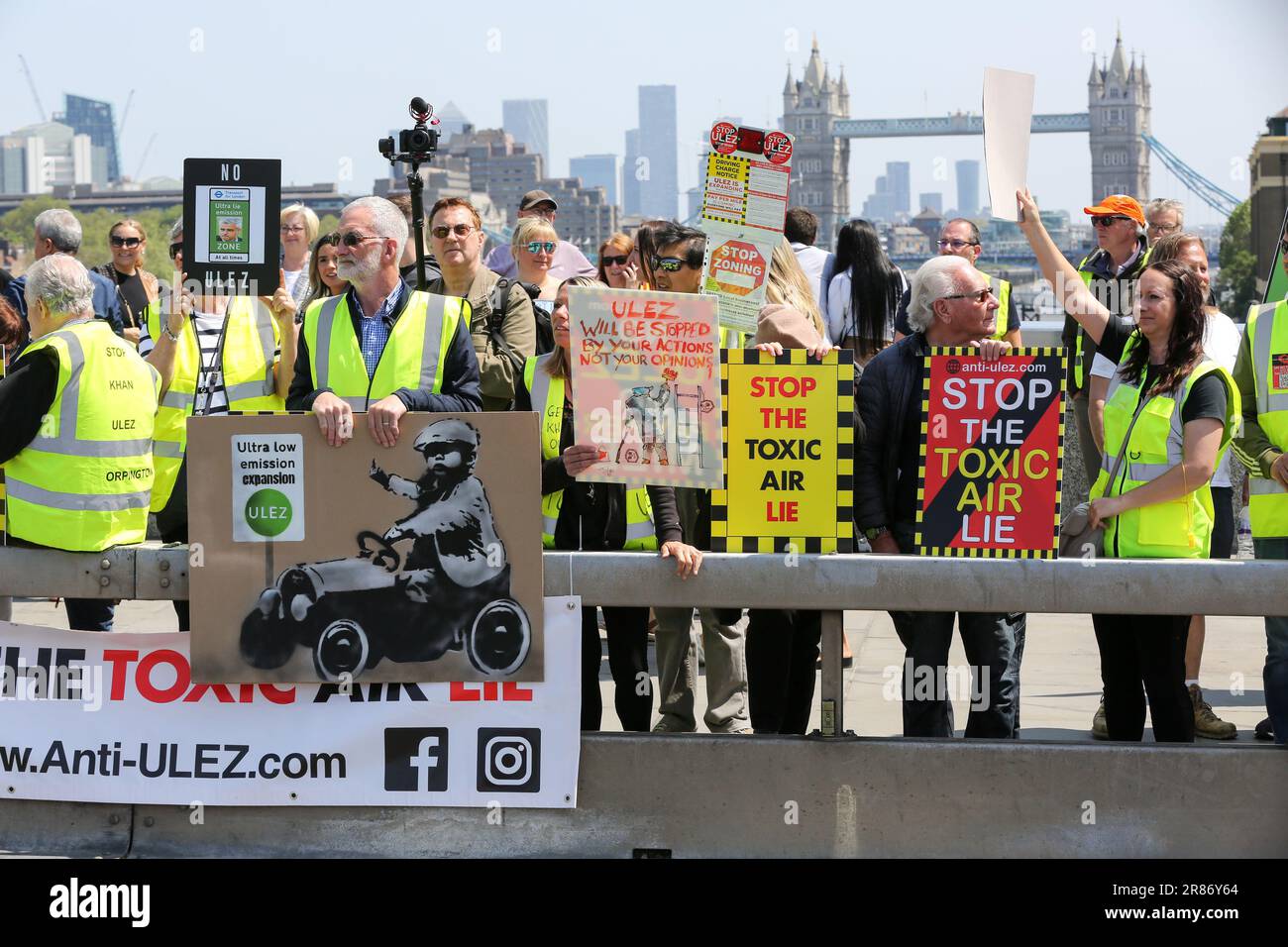 Anti ULEZ campaigners hold signs expressing their opinions on London ...