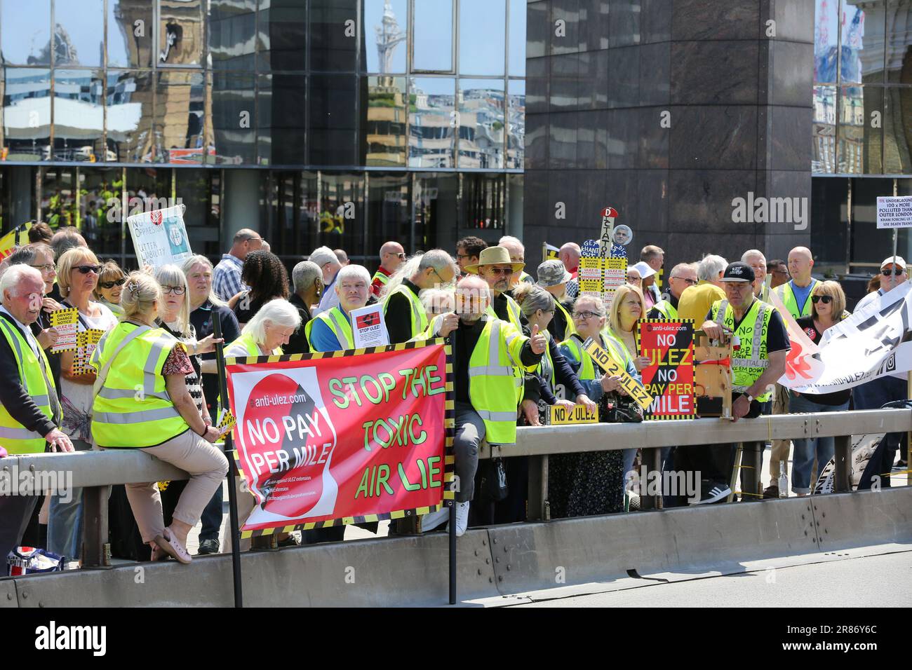 Anti ULEZ campaigners hold signs expressing their opinions on London ...