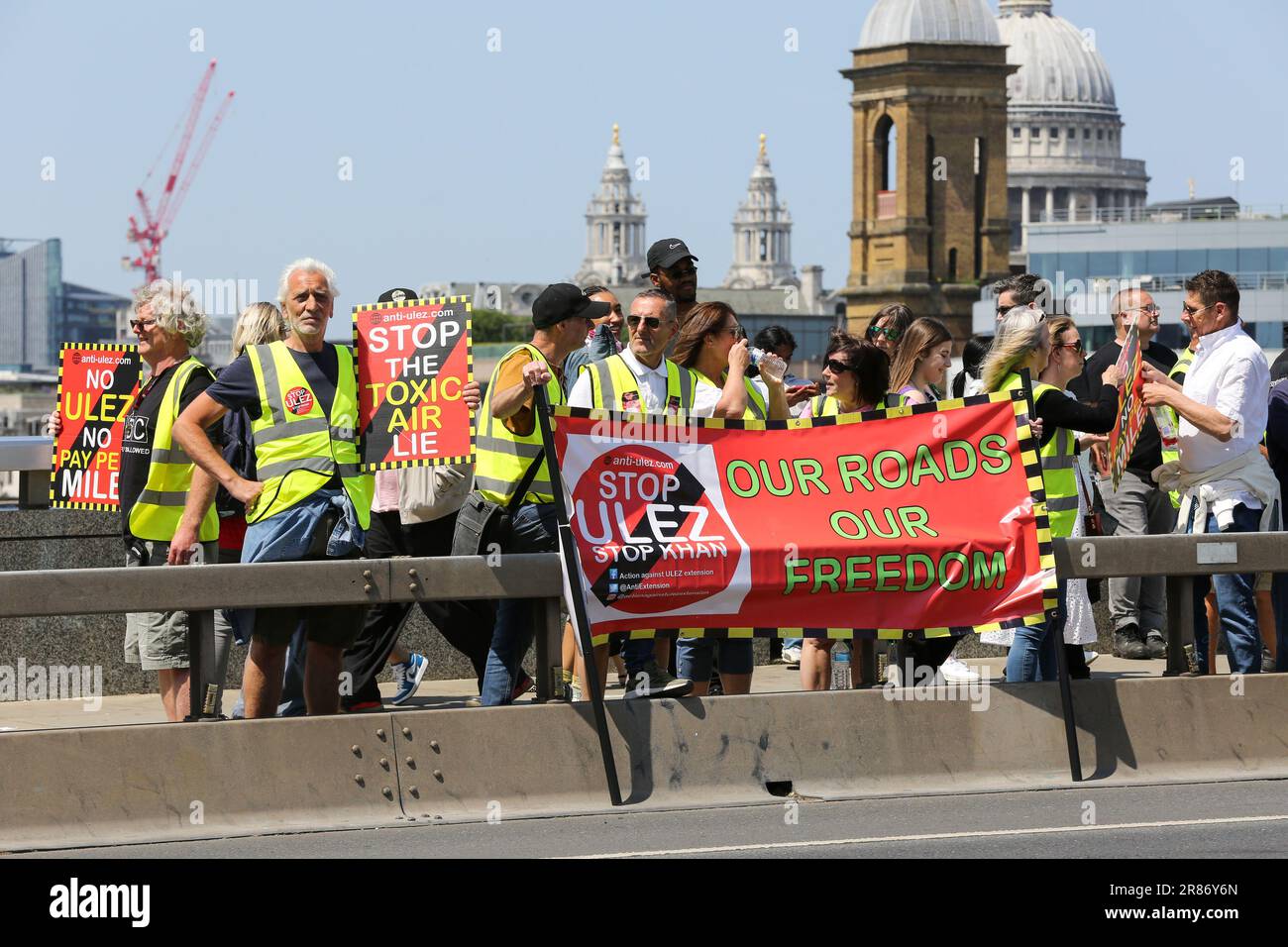 Anti ULEZ campaigners hold signs expressing their opinions on London ...