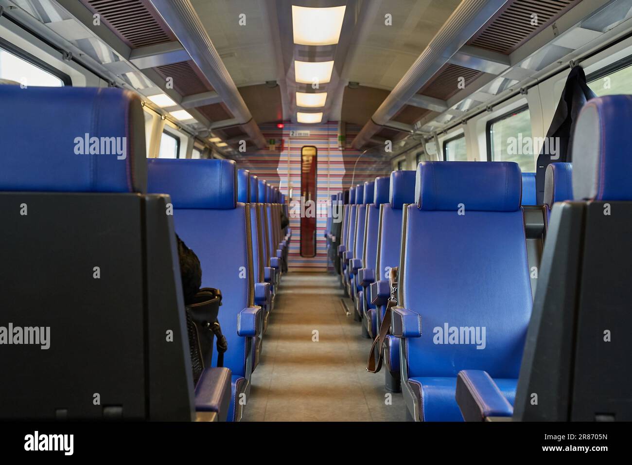 Empty seats inside dark train hi-res stock photography and images - Alamy