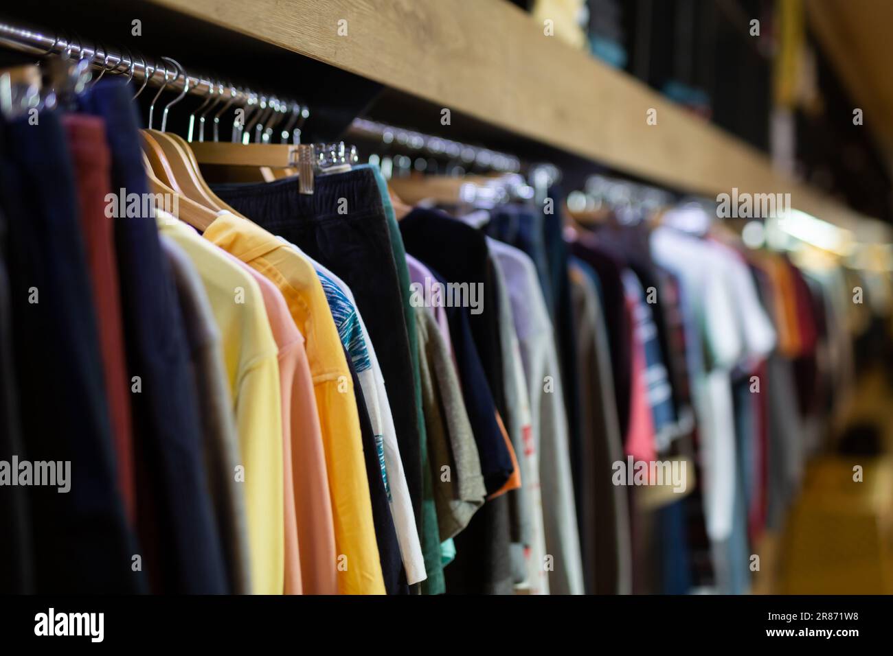 Men clothes in modern garments shop Stock Photo - Alamy