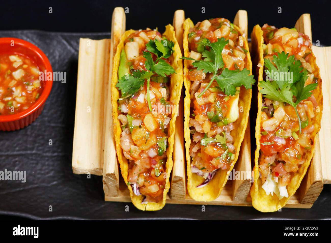 traditional mexican corn taco dish with smoked salmon, tomato salsa ...