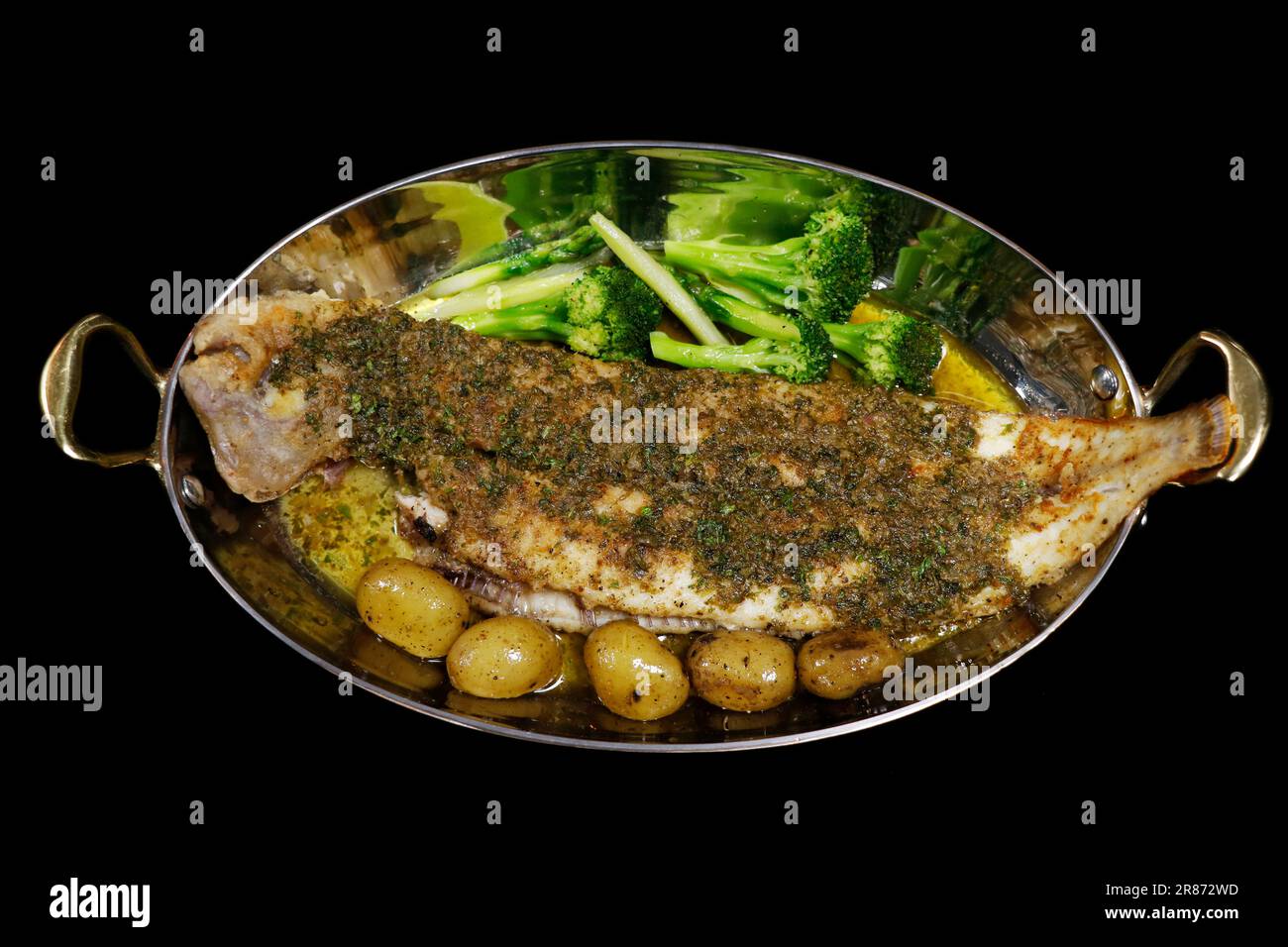 traditional french delicacy sole meuniere with green vegetables, potato ...