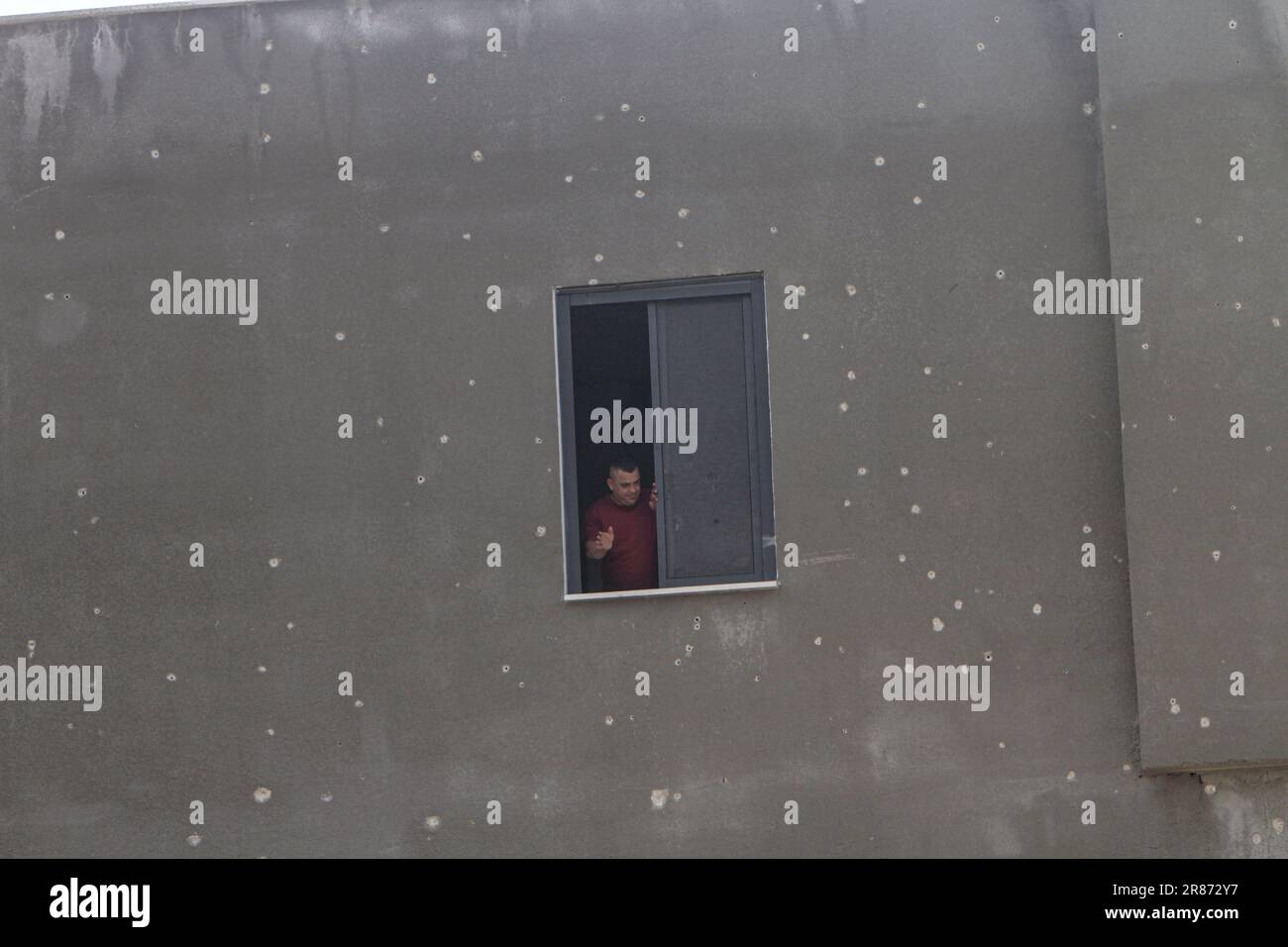 A view of the wall of a house riddled with bullets, during a raid on ...