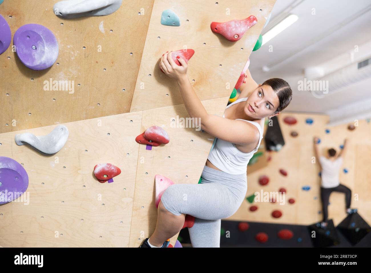 Woman rock climbing without equipment hi-res stock photography and ...