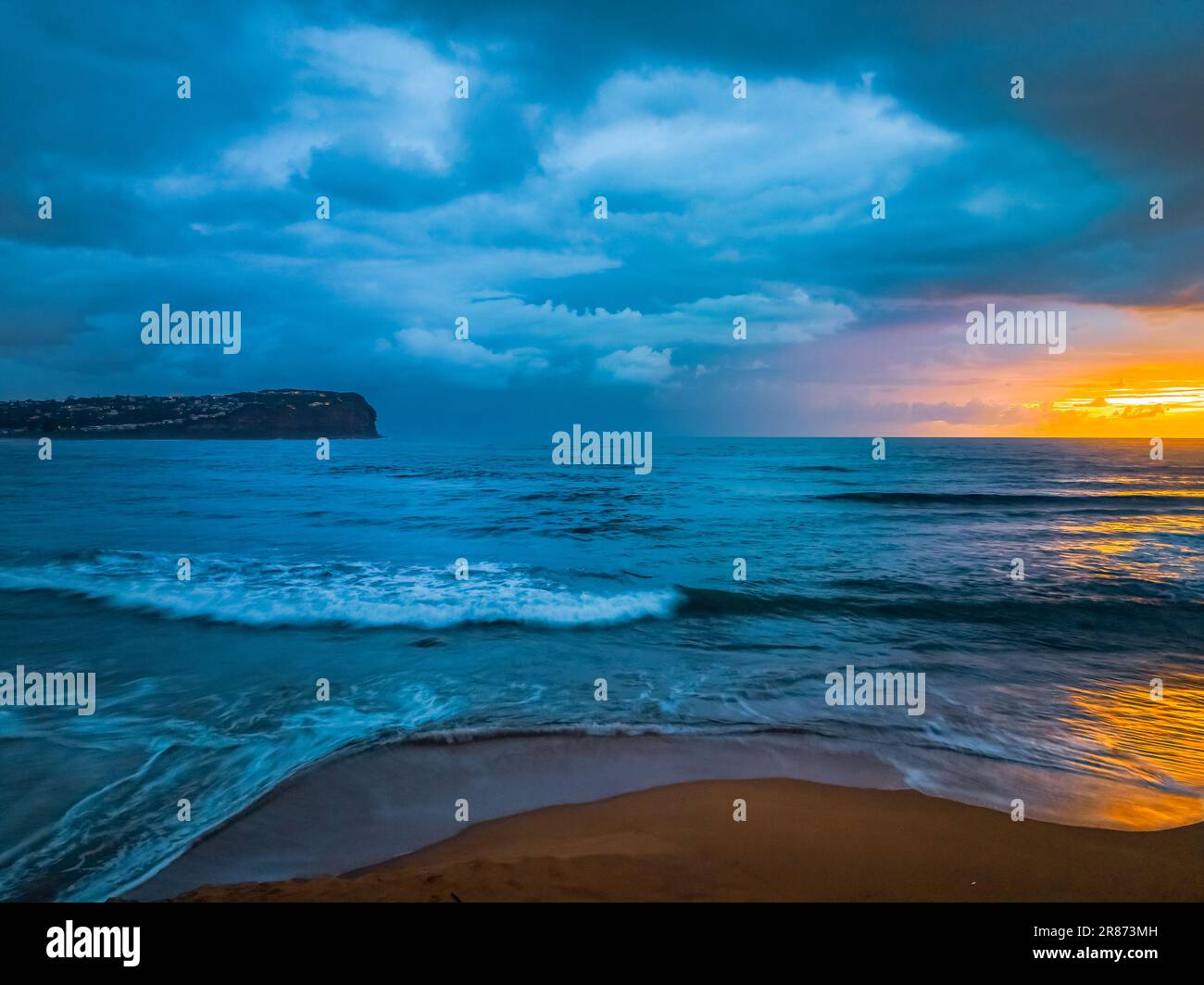Aerial sunrise seascape with rain clouds and waves at Macmasters Beach ...
