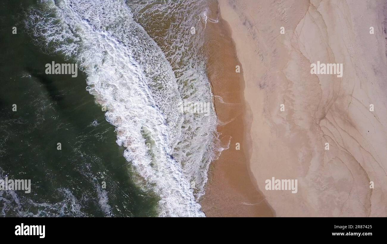 Aerial view of ocean waves crashing on beach, 4K drone footage Stock ...