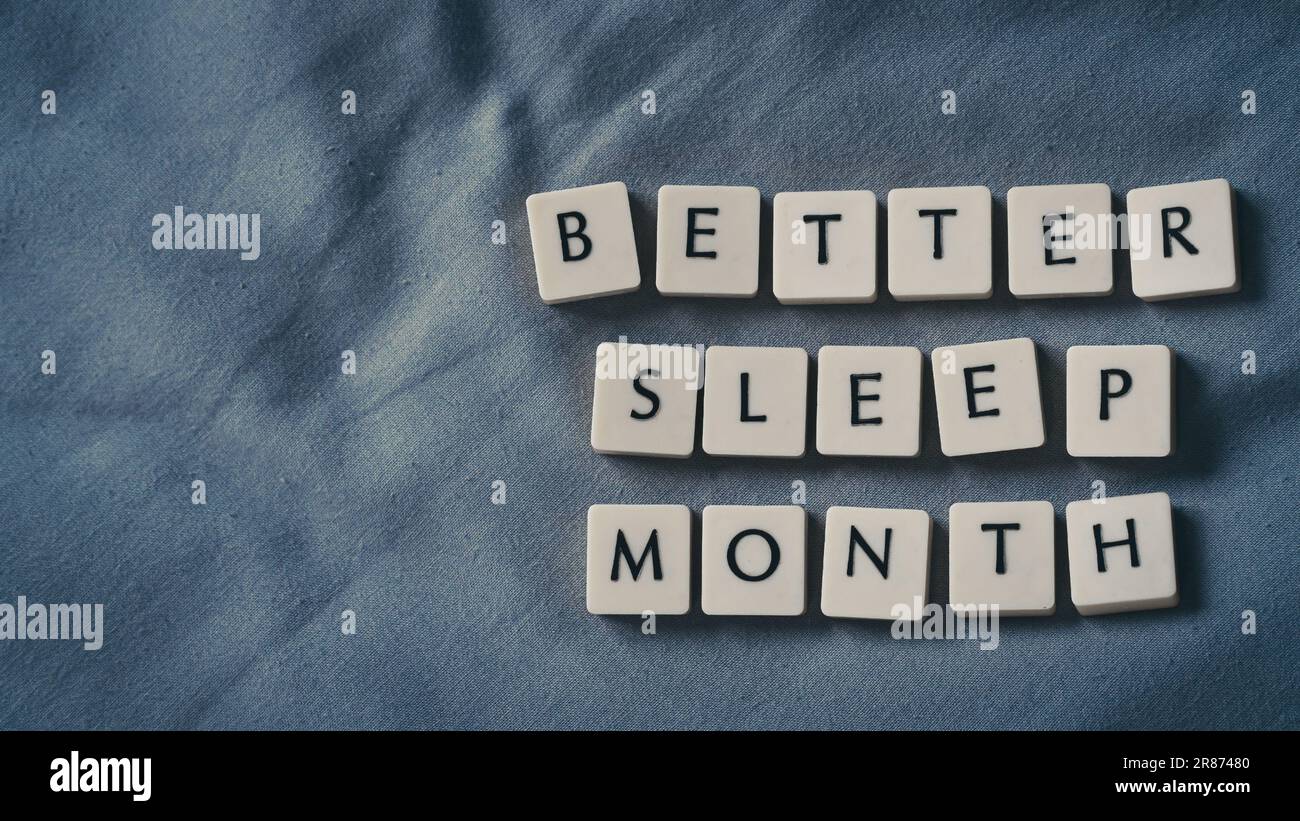 Better sleep month. Better sleep month words on soft bed. High angle ...