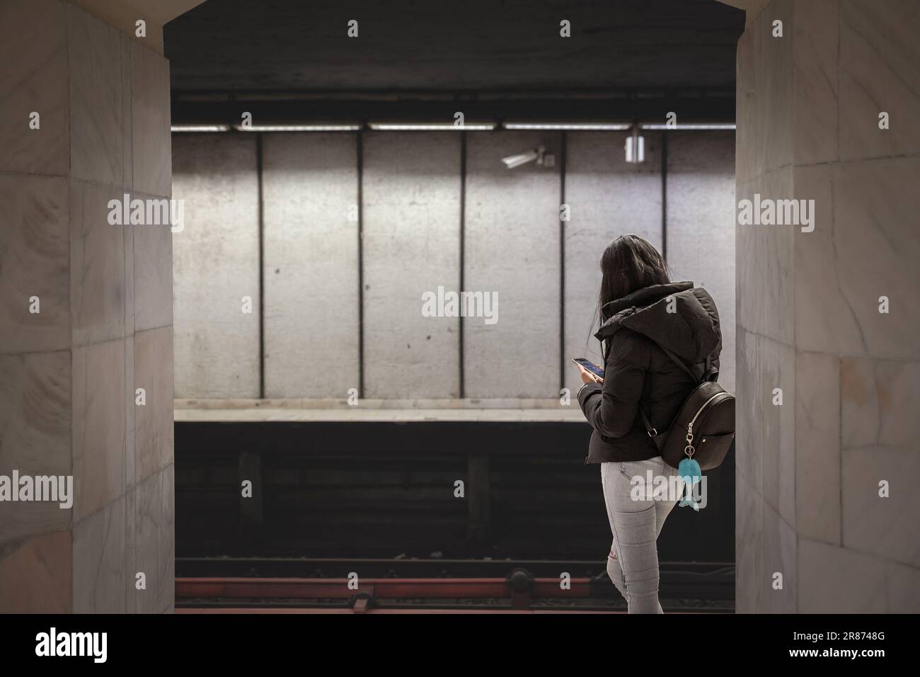 Picture of a girl waiting for a metro of Bucharest Metro, on Line 2.The ...