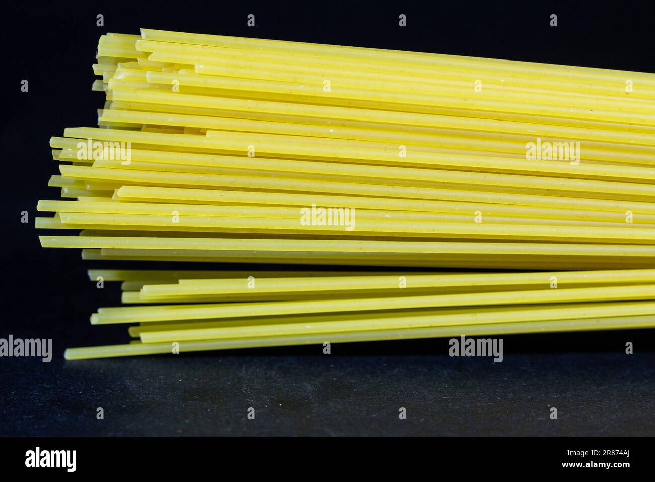 Picture of spaghetti, isolated on a black background. Spaghetti is a ...