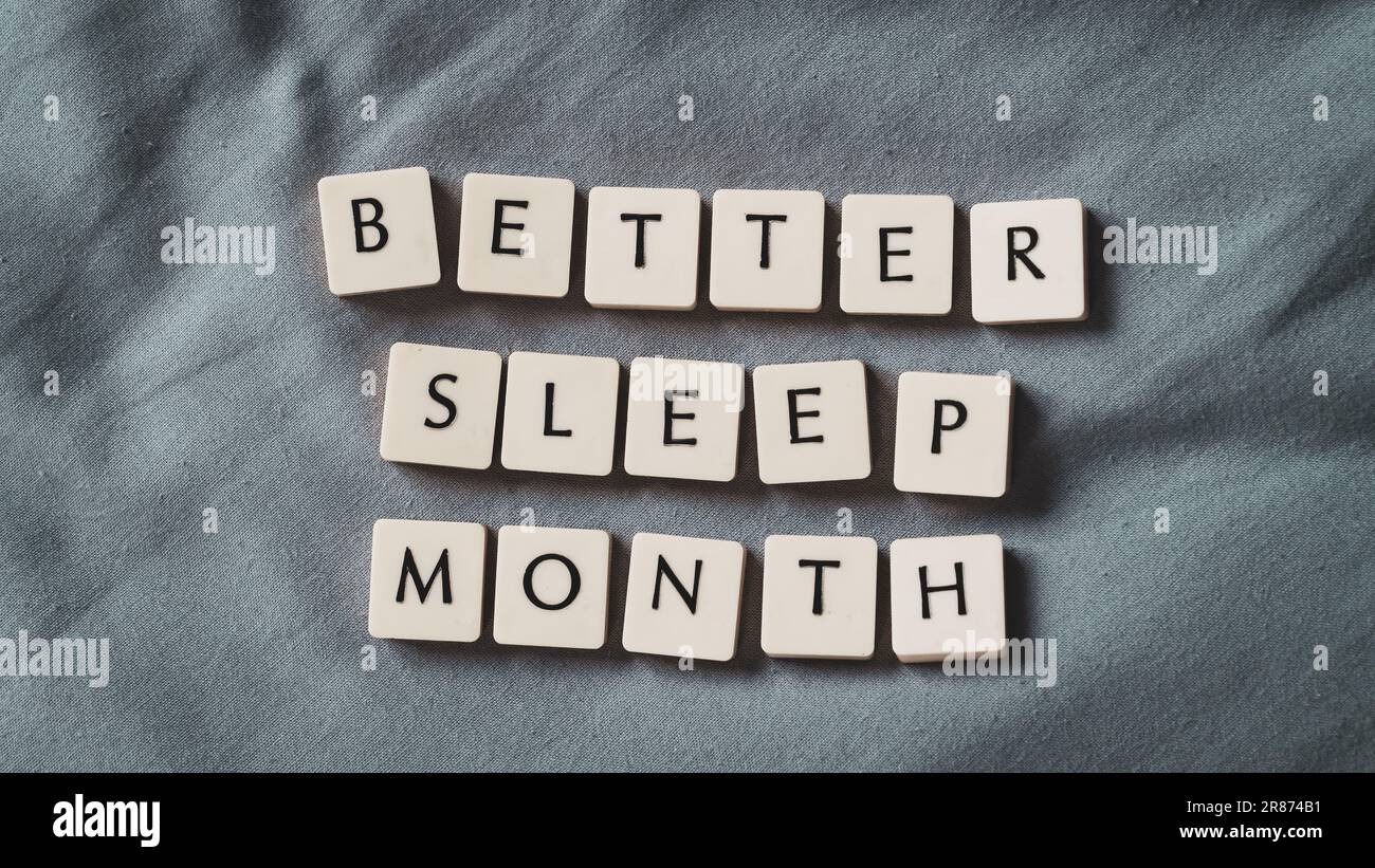 Better sleep month. Better sleep month words on soft bed. High angle ...