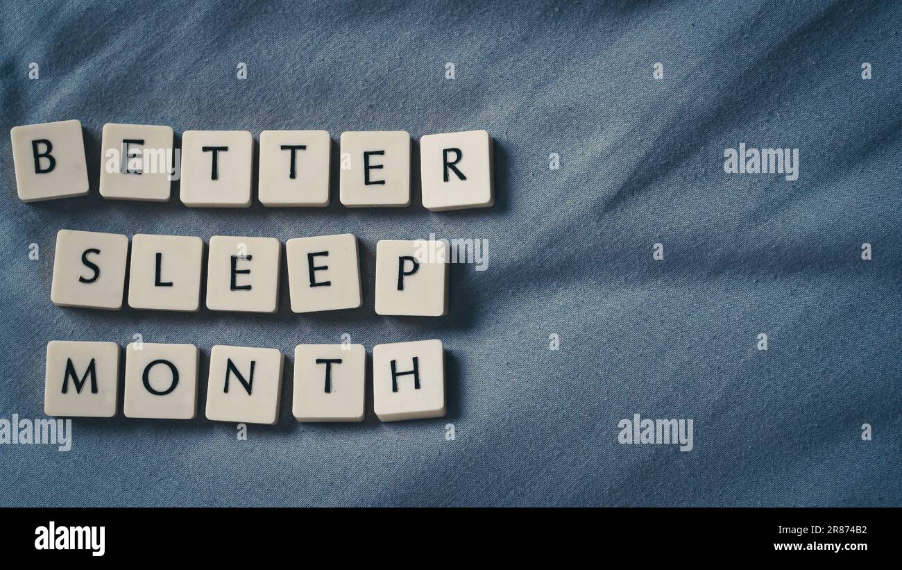 Better sleep month. Better sleep month words on soft bed. High angle ...