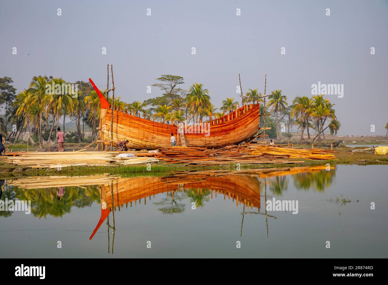 Fishing boats making at Char Fasson in Bhola. Bangladesh Stock Photo ...