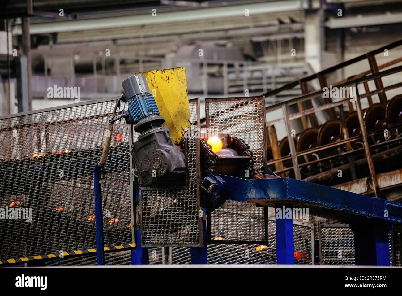 Working ball rolling mill. Production of steel grinding balls Stock ...