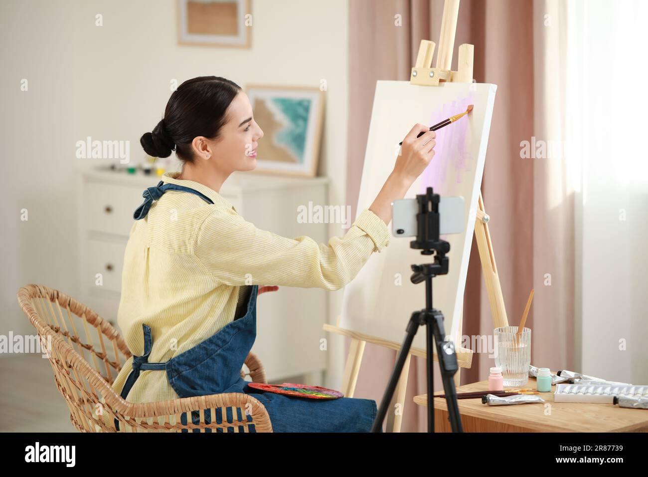 Teacher conducting online painting lesson at home. Time for hobby Stock ...