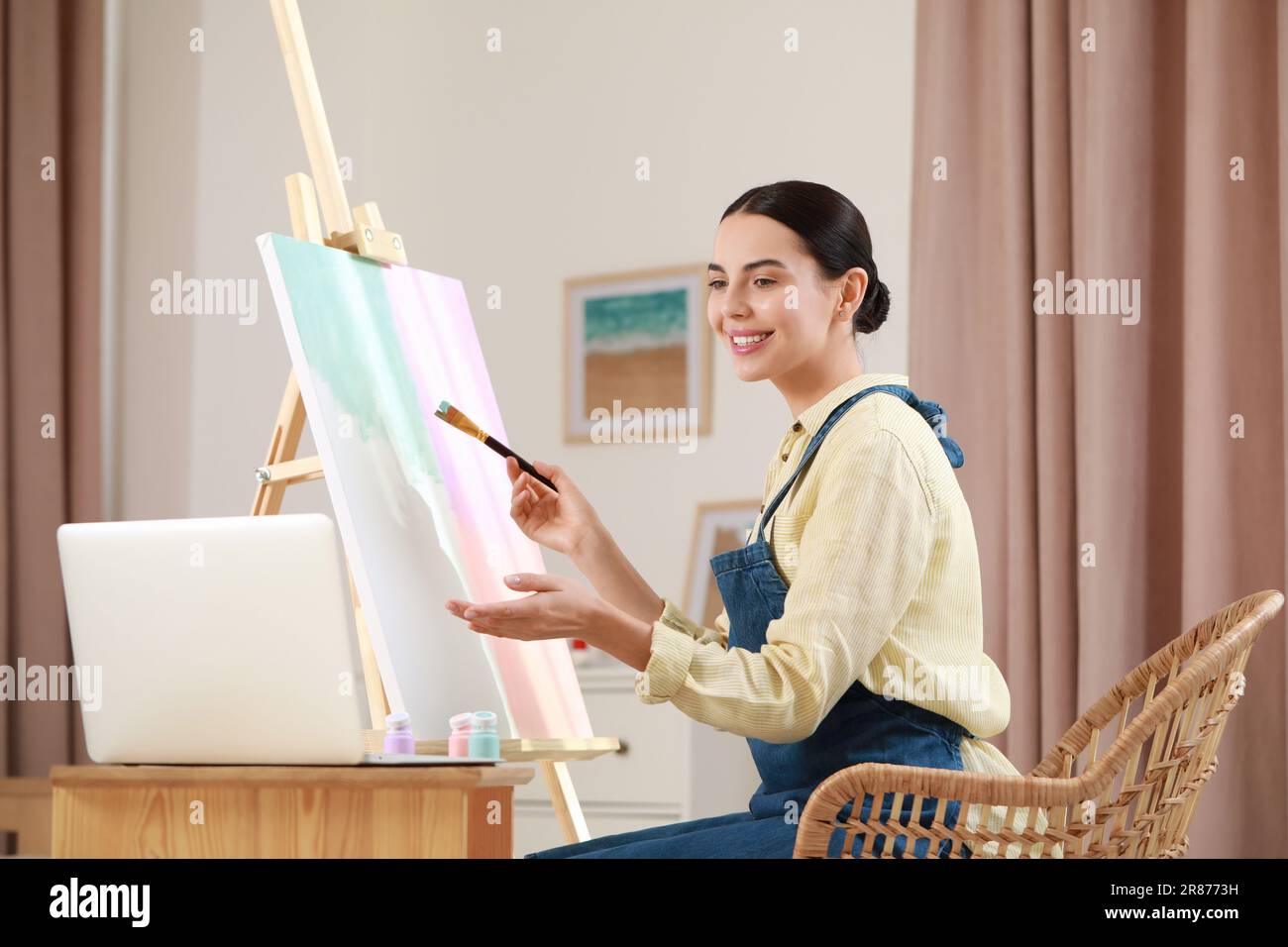 Teacher conducting online painting lesson at home. Time for hobby Stock ...