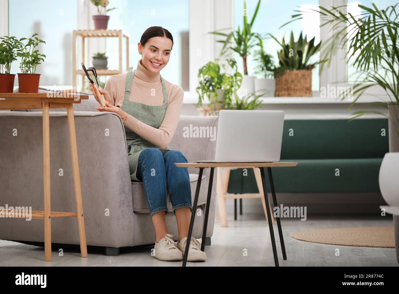 Teacher conducting online gardening course at home. Time for hobby ...