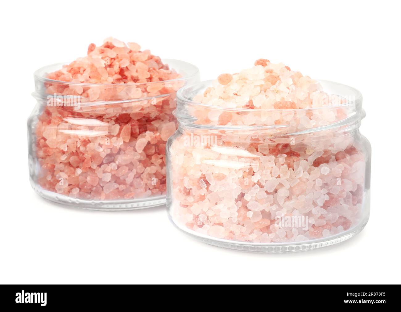 Glass jars with natural sea salt on white background Stock Photo - Alamy