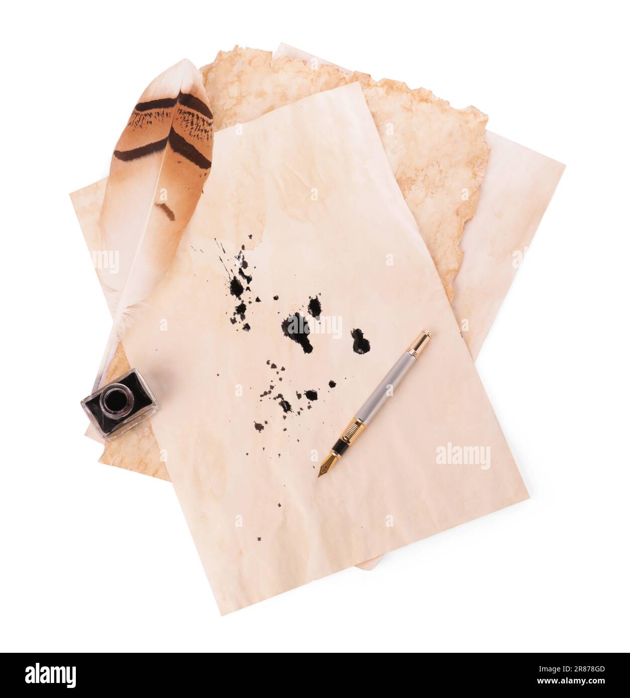 Parchment with stains of ink, feather pen and inkwell on white ...