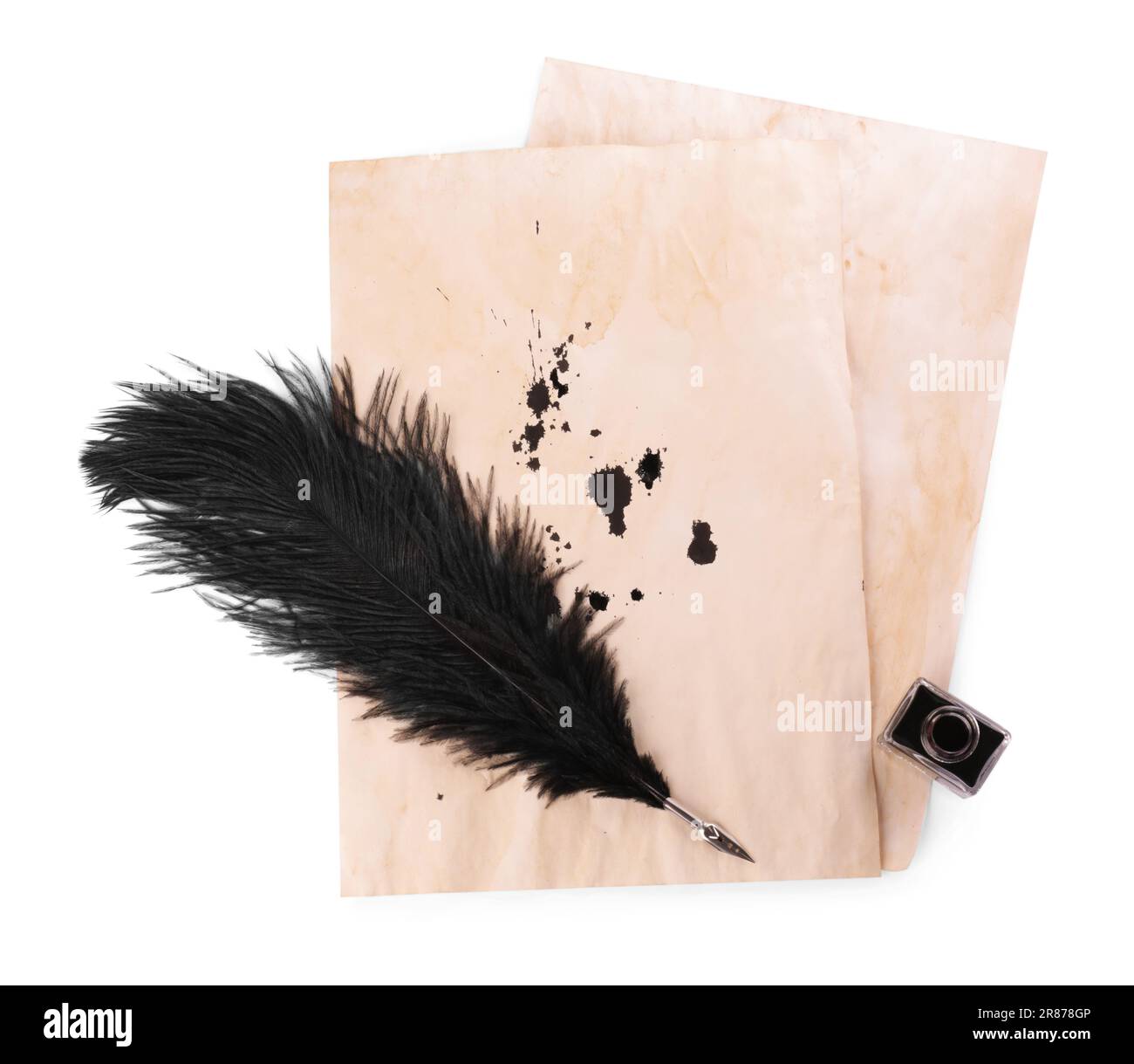 Parchment with stains of ink, feather pen and inkwell on white ...