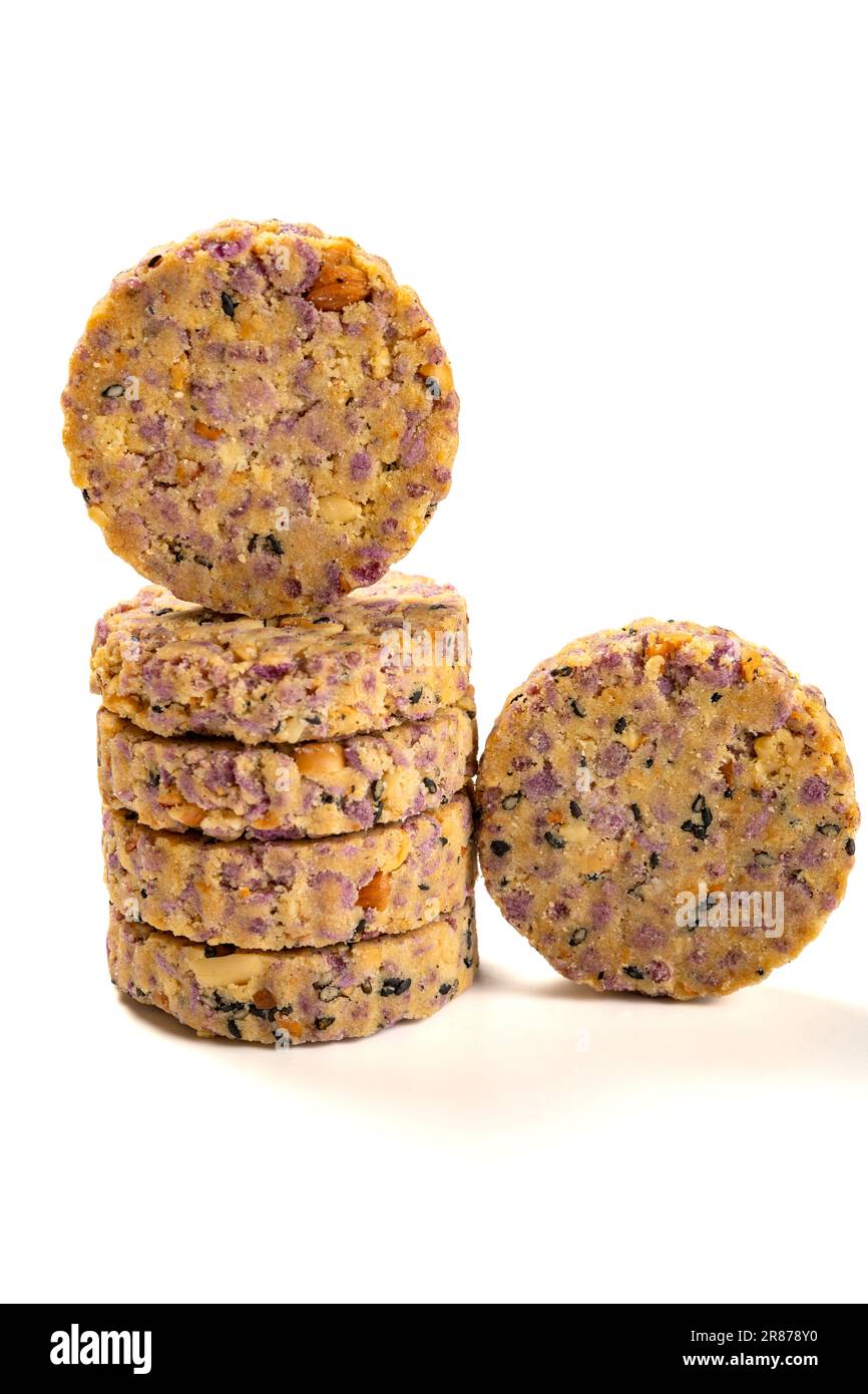 angle view crisp purple rice cakes on white background at vertical ...