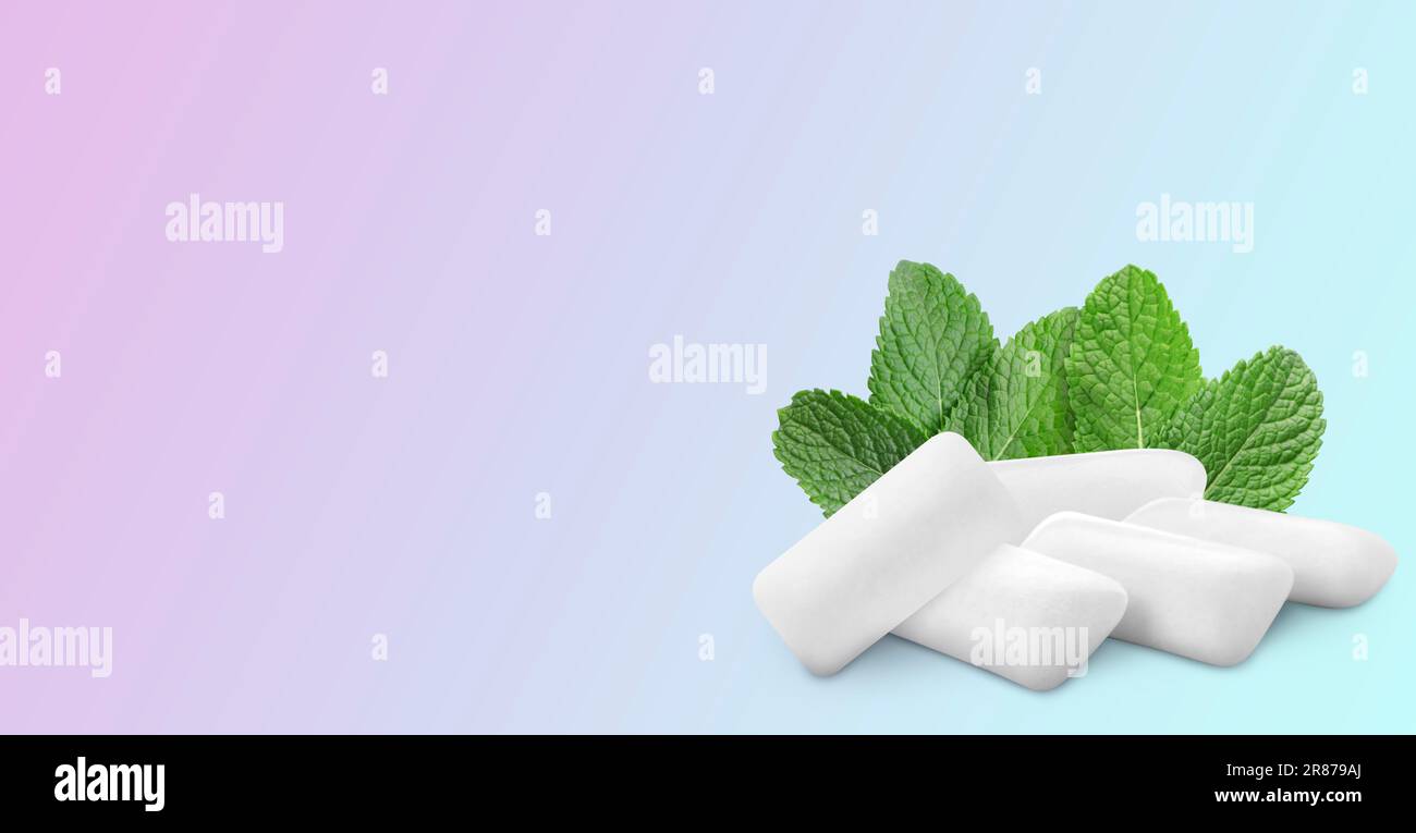 Menthol chewing gum pillows and mint leaves on color gradient ...