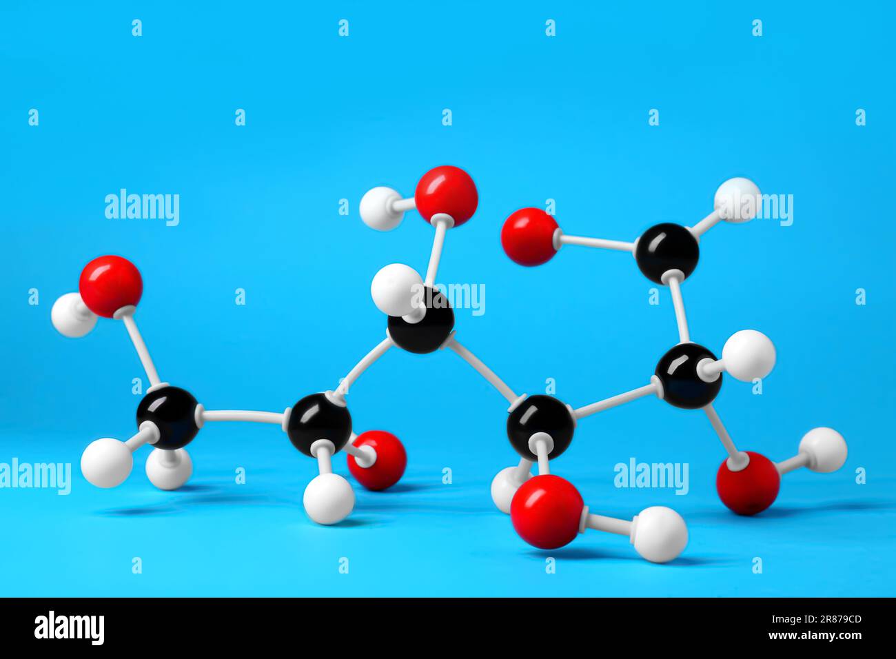 Molecule of glucose on light blue background. Chemical model Stock ...