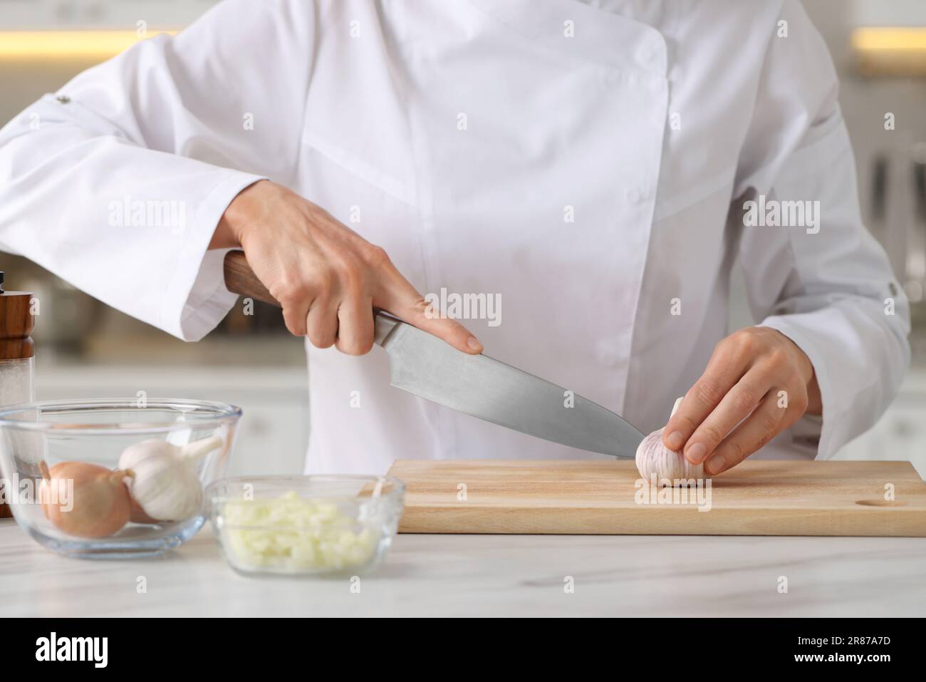 Female chef preparing garlic recipe hi-res stock photography and images ...