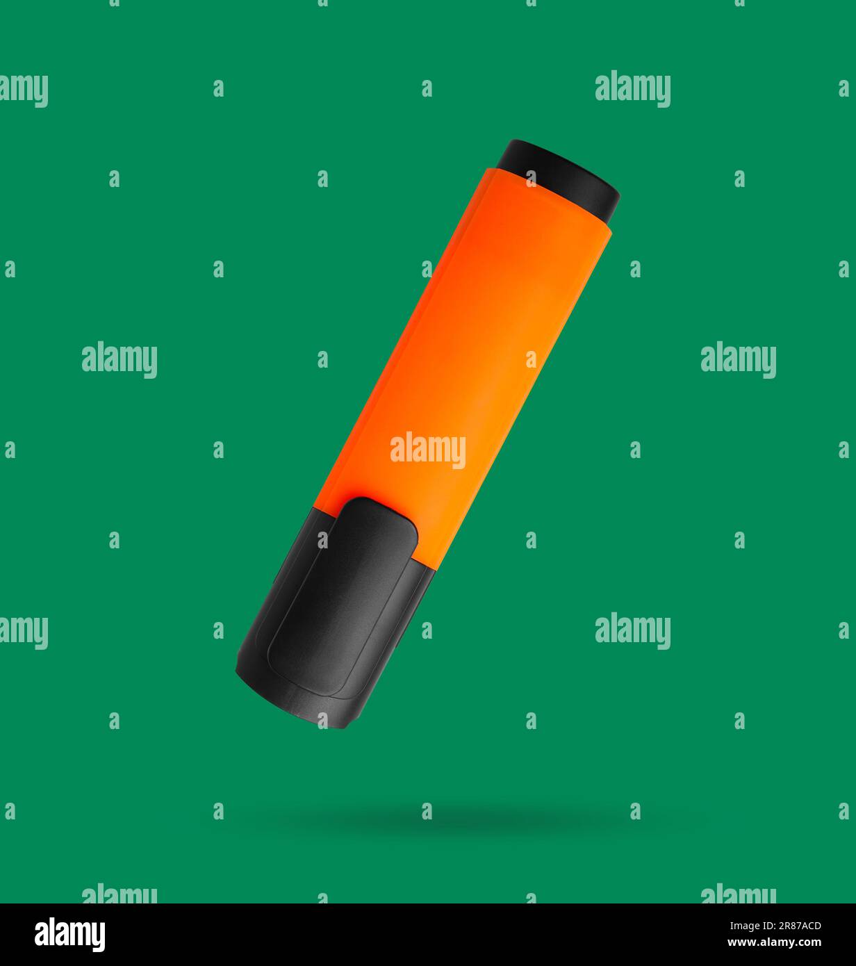 Orange marker falling on green background. Highlighter Stock Photo - Alamy
