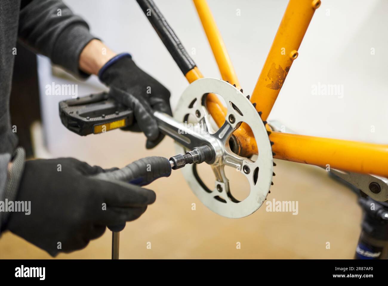 Maintenance of a bicycle: hands of an unrecognizable person using ...