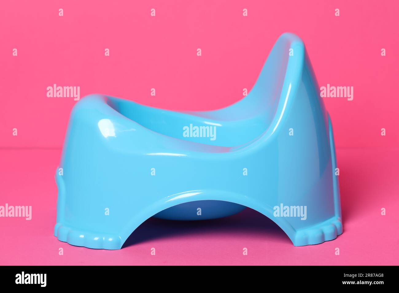 Light blue baby potty on pink background. Toilet training Stock Photo ...