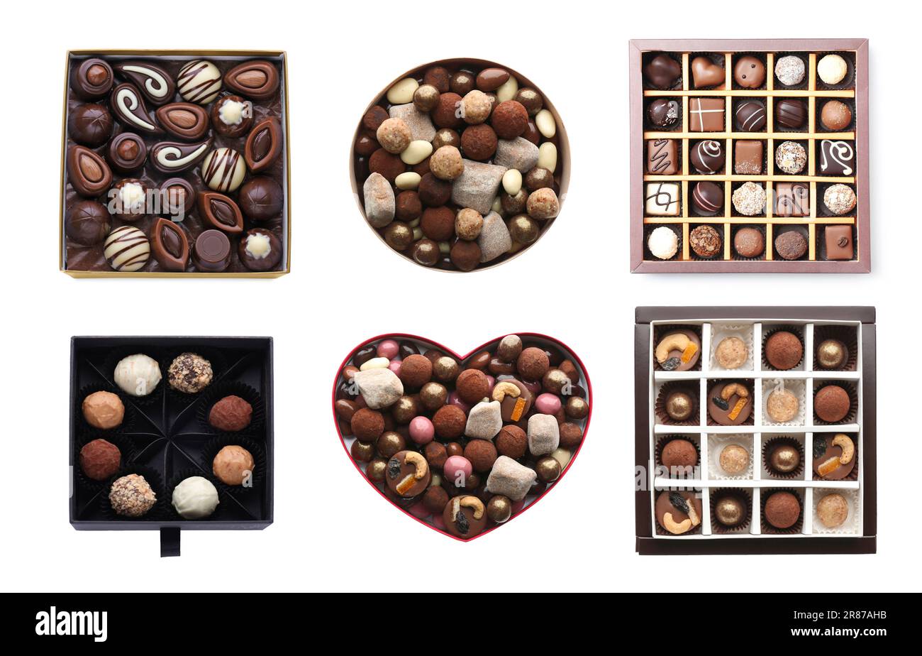 Many boxes with tasty different chocolate candies on white background ...