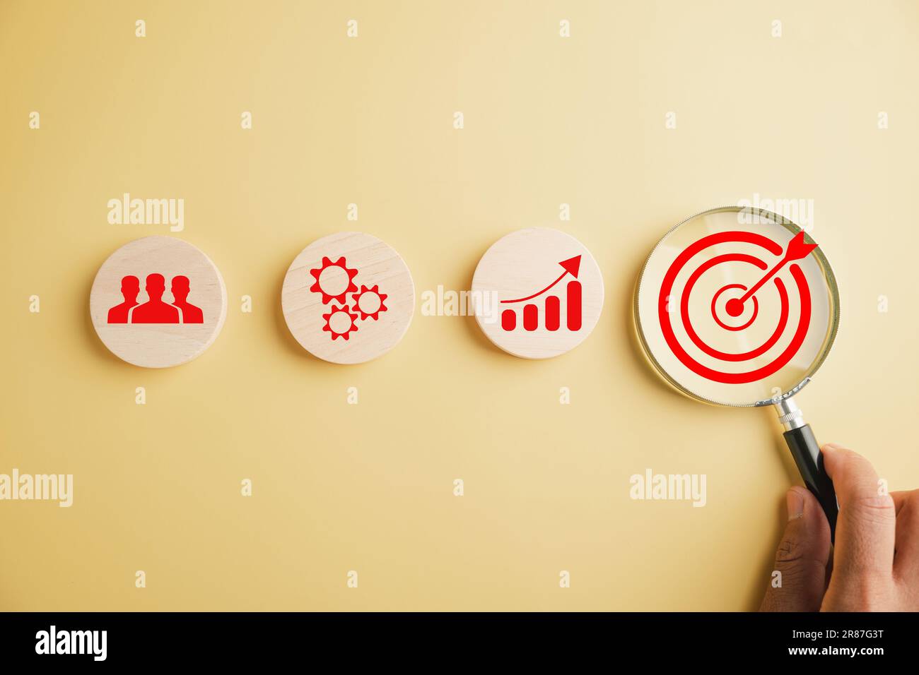 Target icon under magnifying glass Stock Photo - Alamy