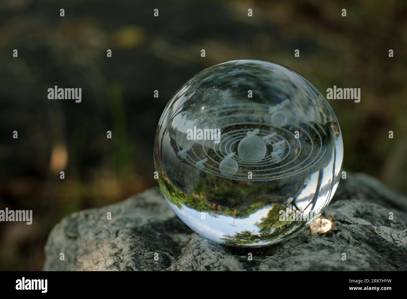 Nature photography of crystal ball with solar system in it, space ...