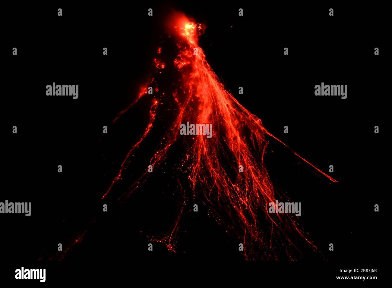 FILE - Lava flows down the slopes of Mayon volcano as seen from Legazpi ...