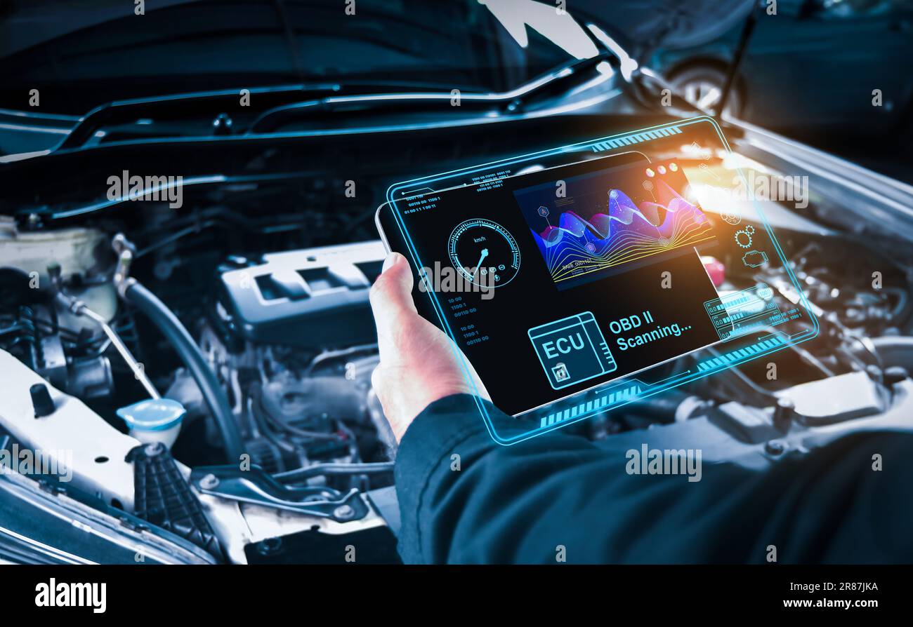 Auto mechanic checking ECU engine system with OBD2 wireless scanning ...