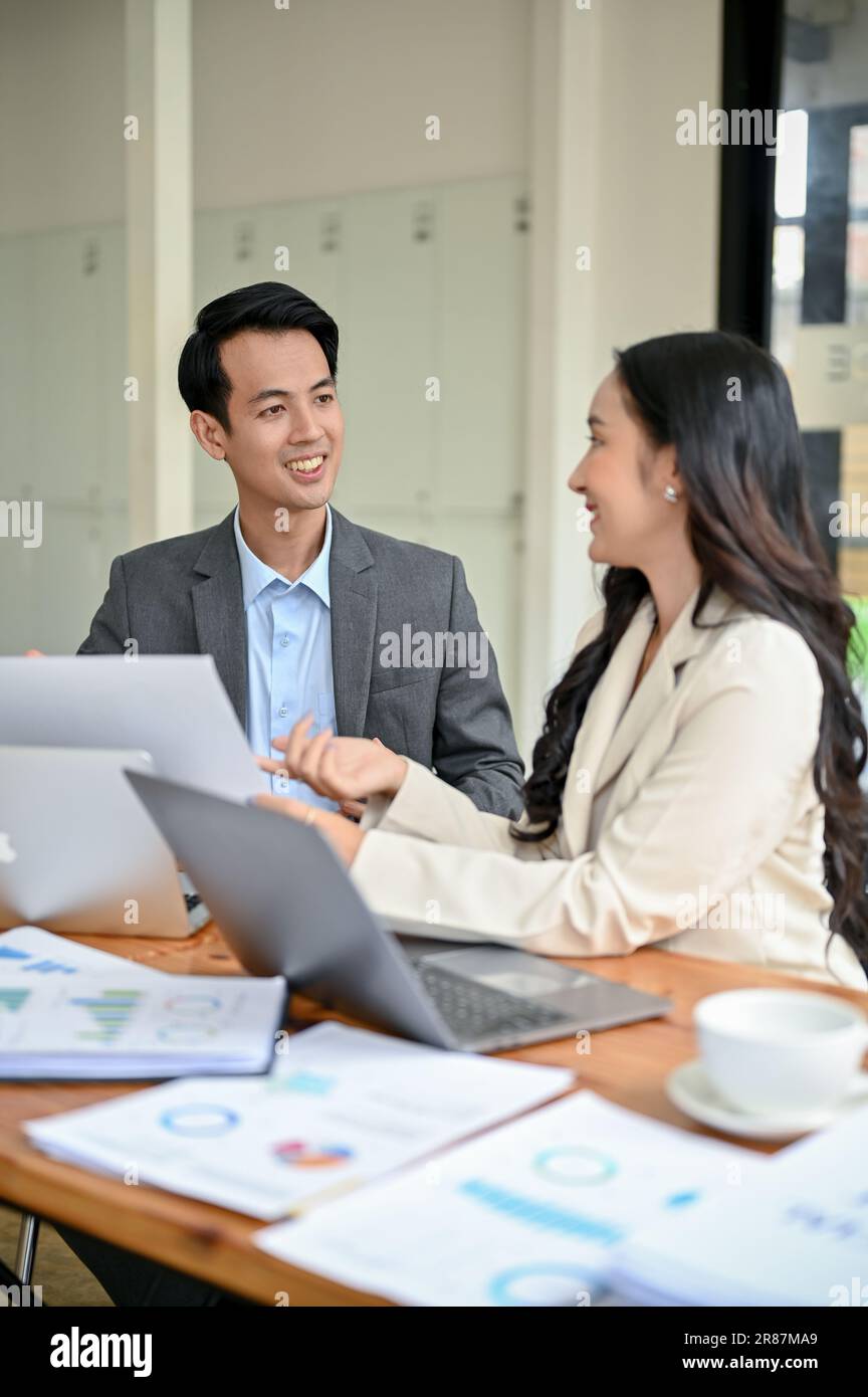 A beautiful millennial Asian businesswoman or female office worker ...