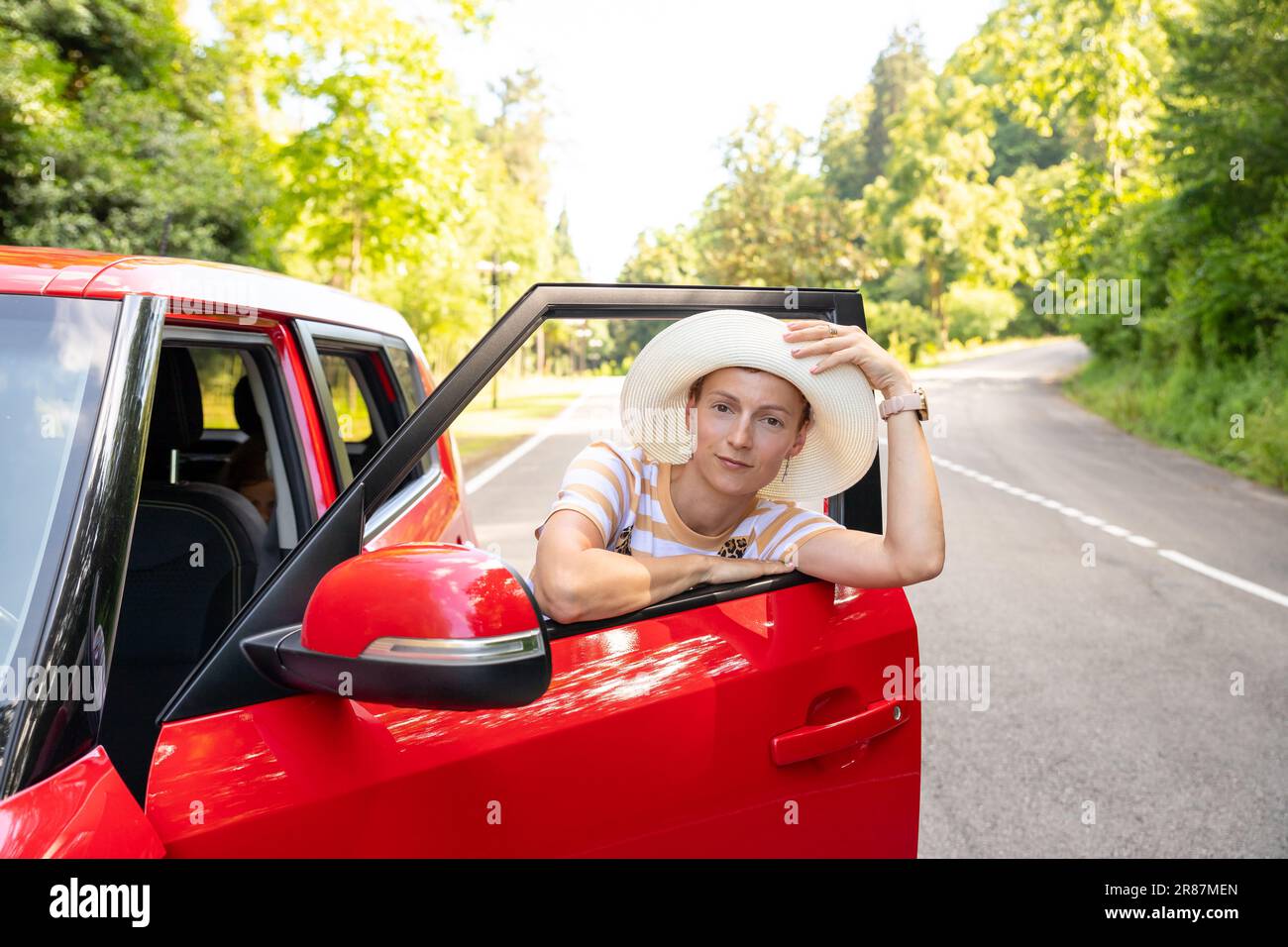 Photo of positive cheerful girl funky driver rider enjoy drive ride car ...