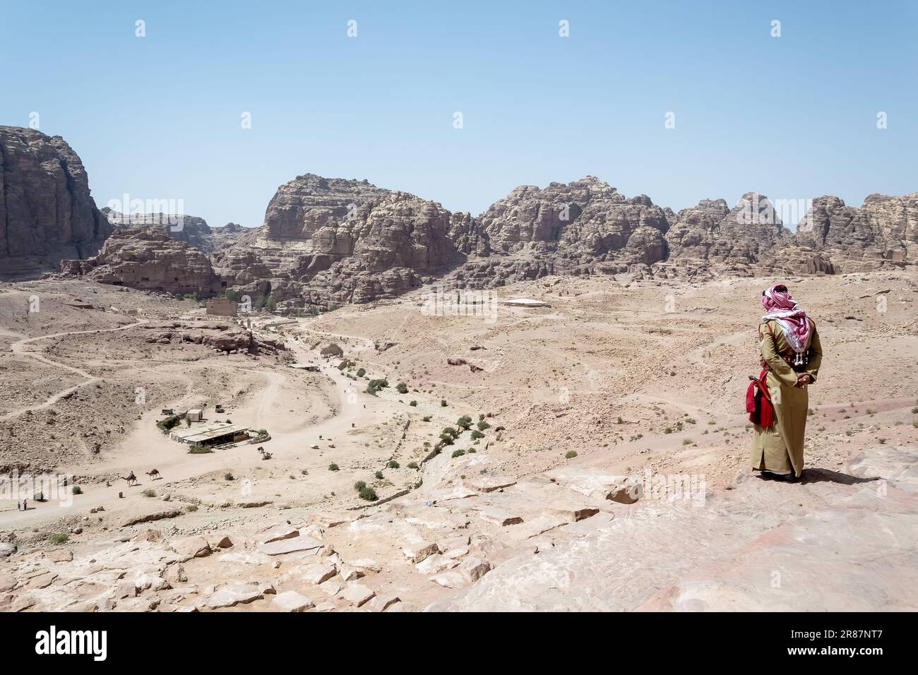 A soldier of the Royal Guard watching over the city of Petra, Jordan in ...