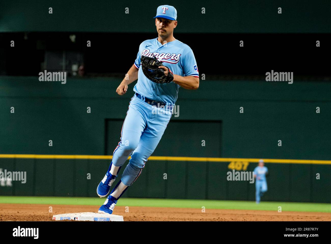 Texas Rangers first baseman Nathaniel Lowe (30) steps on first base to ...